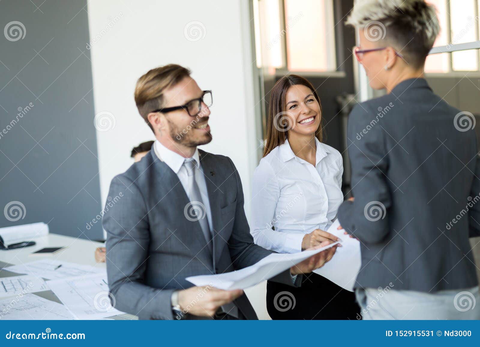 Picture of Business Colleagues Talking in Office Stock Image - Image of ...