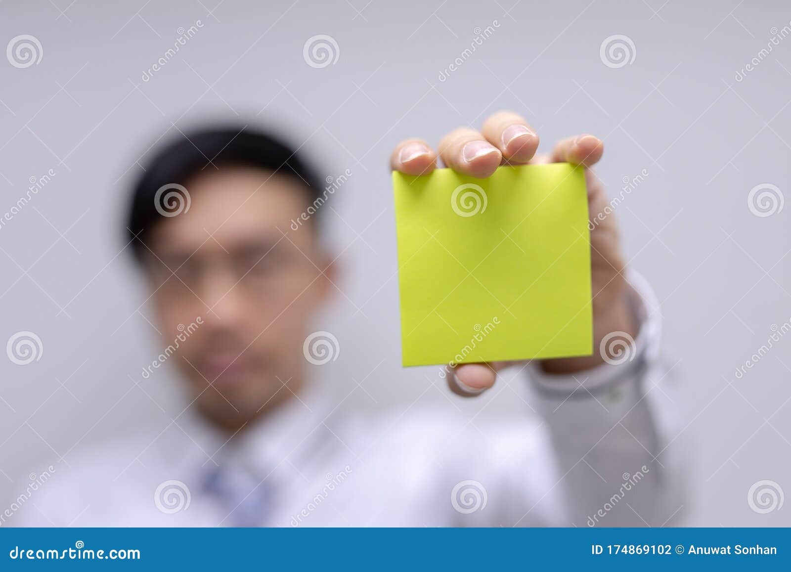Picture of a Business Man Carrying a Yellow Post-it Note Stock Photo ...