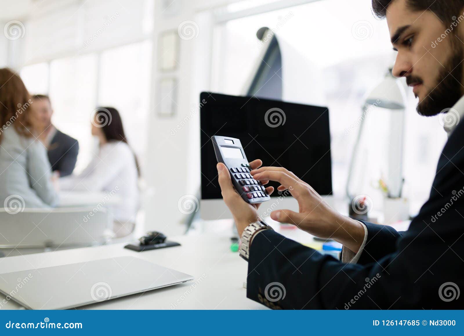 Picture of Busy Man Using Calculator in Office Stock Image - Image of ...