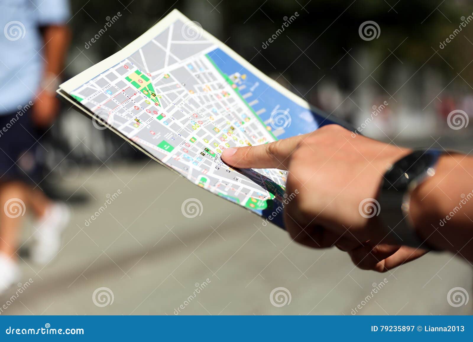 Picture of a Close Up Man is Looking for Directions on the Map Outside ...