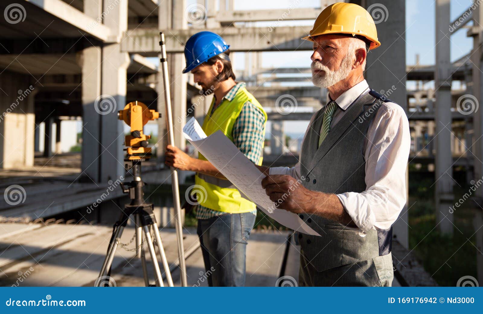Picture of Construction Site Engineer Looking at Blueprint Stock Photo ...