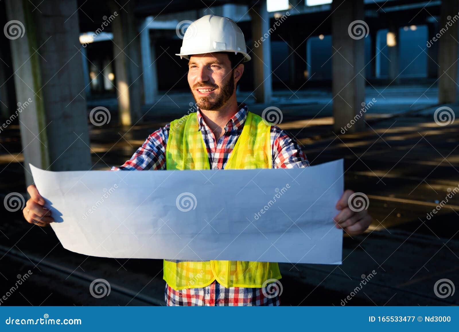 Picture of Construction Site Engineer Looking at Blueprint Stock Image ...
