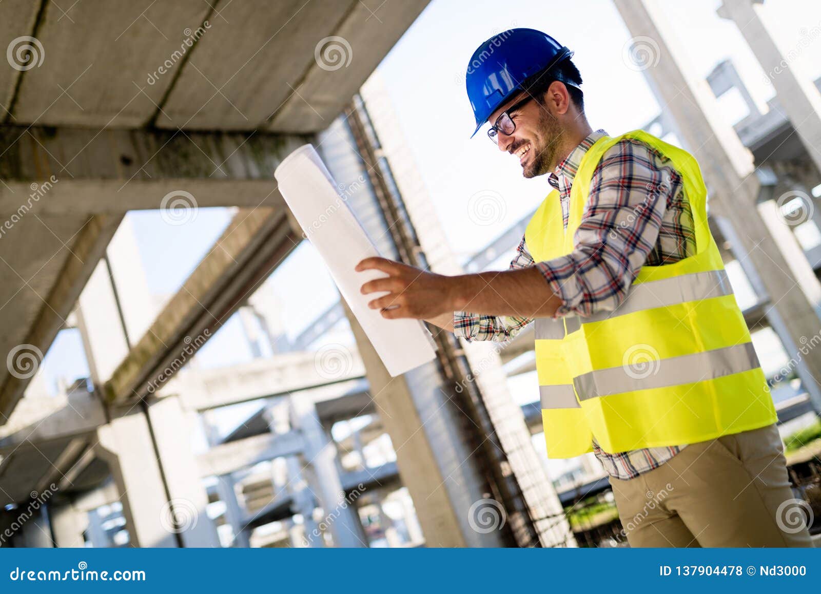 Picture of Construction Site Engineer Looking at Plan Stock Photo ...