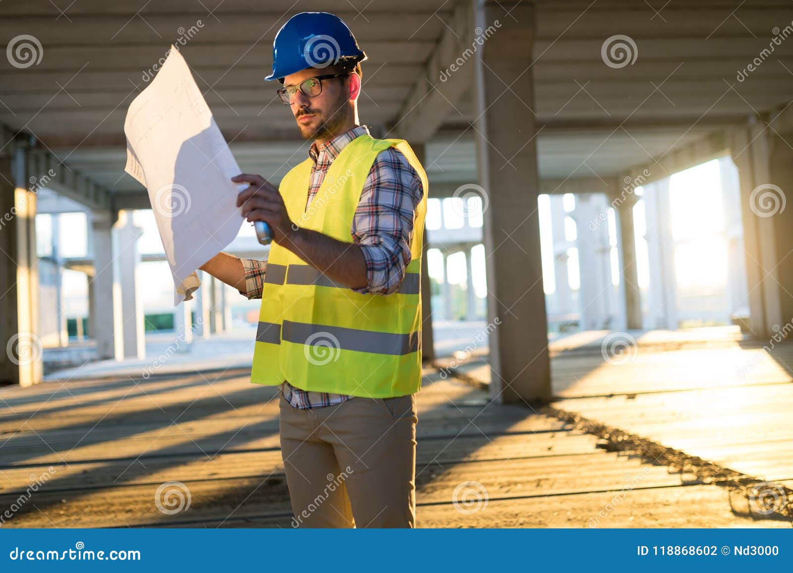Picture of Construction Site Engineer Looking at Plan Stock Photo ...