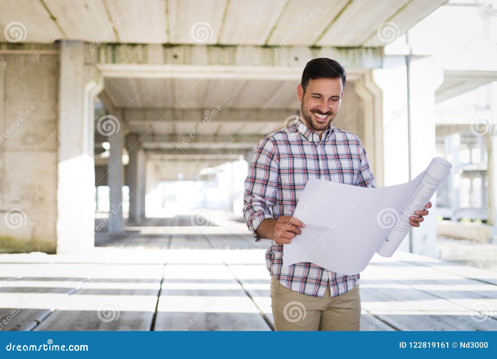 Picture of Construction Site Engineer Looking at Plan Stock Image ...