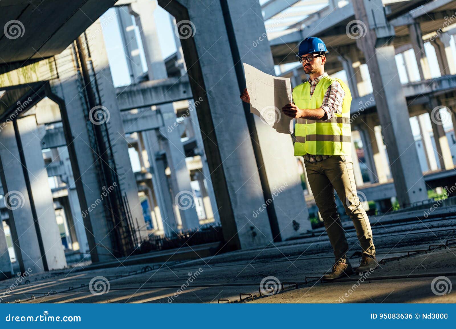 Picture of Construction Site Engineer Looking at Plan Stock Photo ...