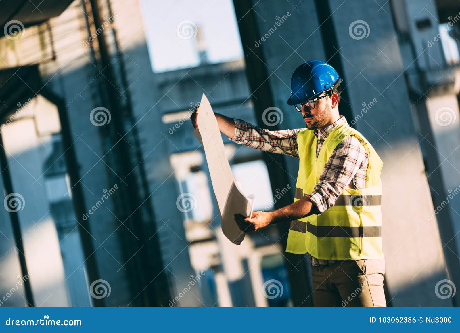 Picture of Construction Site Engineer Looking at Plan Stock Photo ...