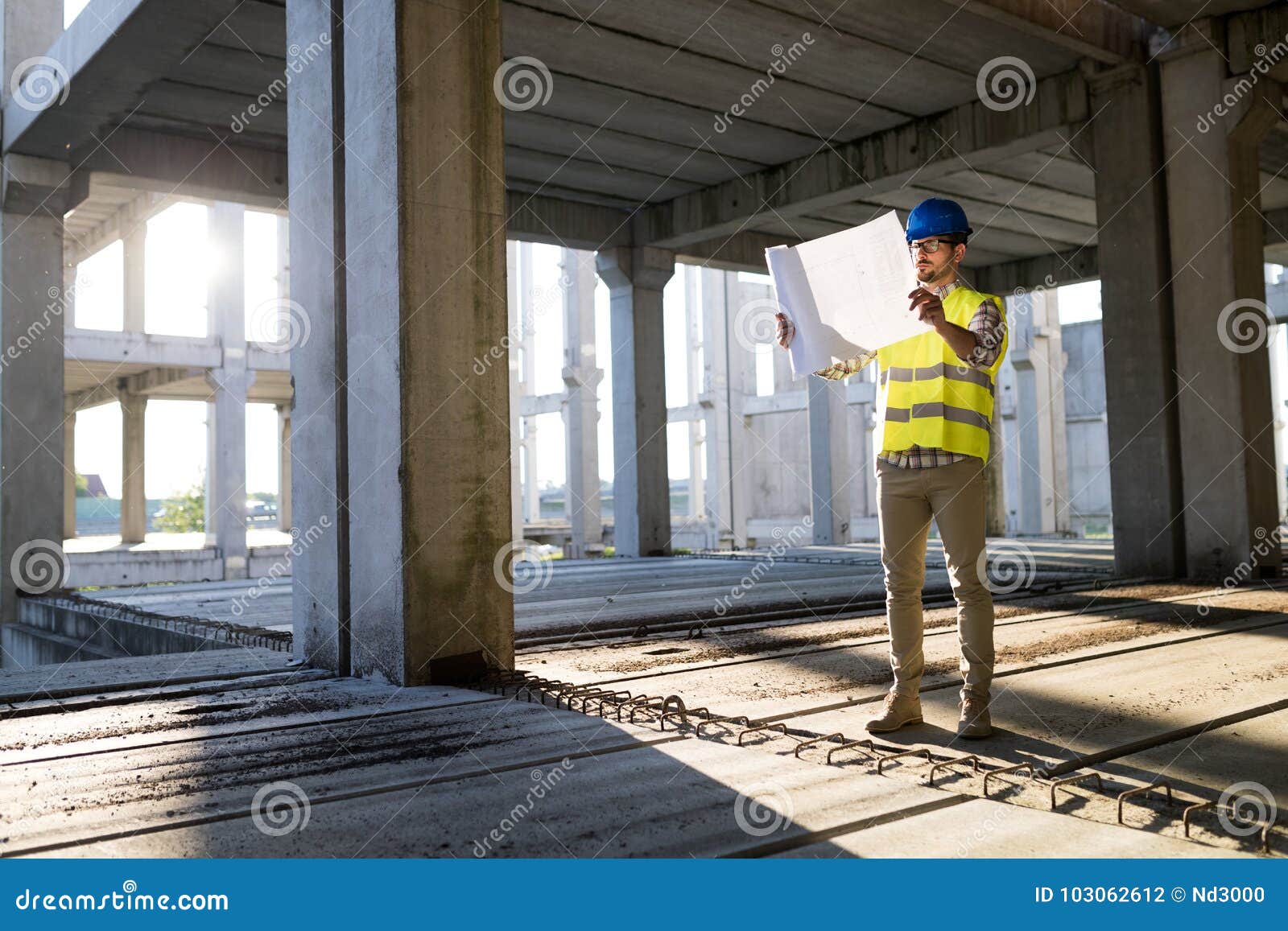 Picture of Construction Site Engineer Looking at Plan Stock Photo ...