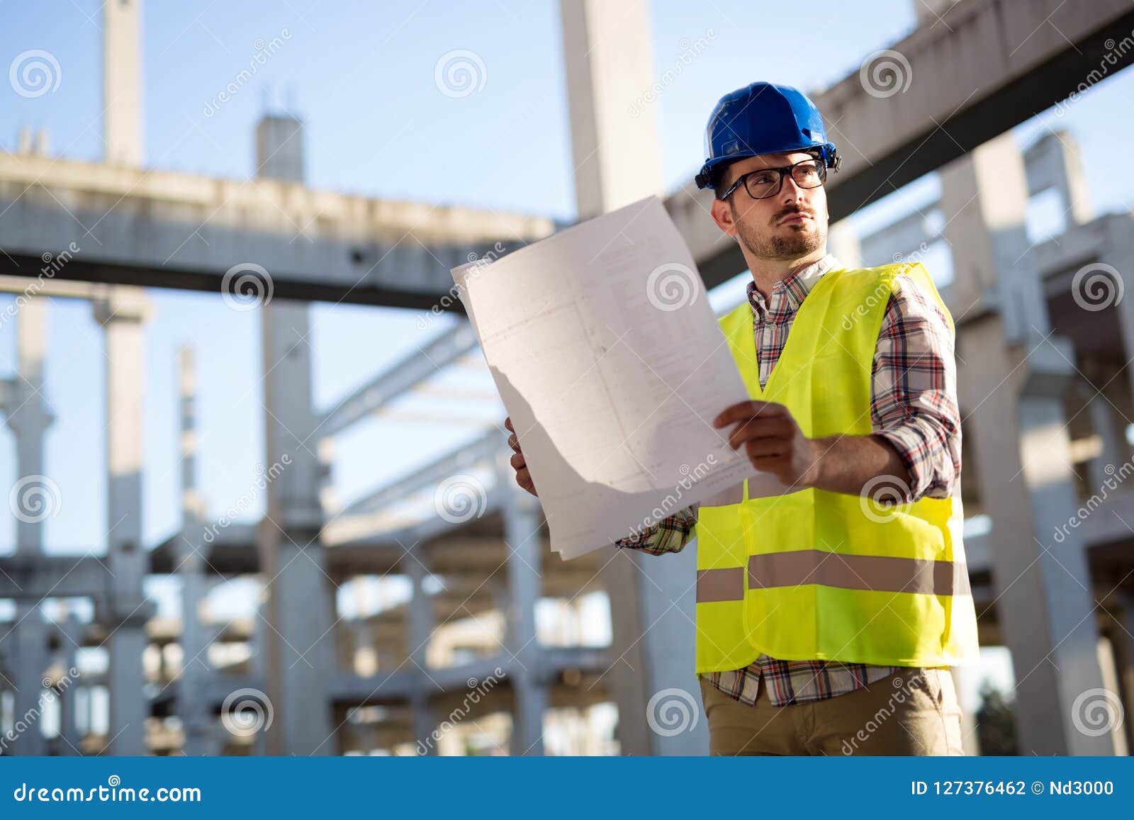 Picture of Construction Site Engineer Looking at Plan Stock Photo ...