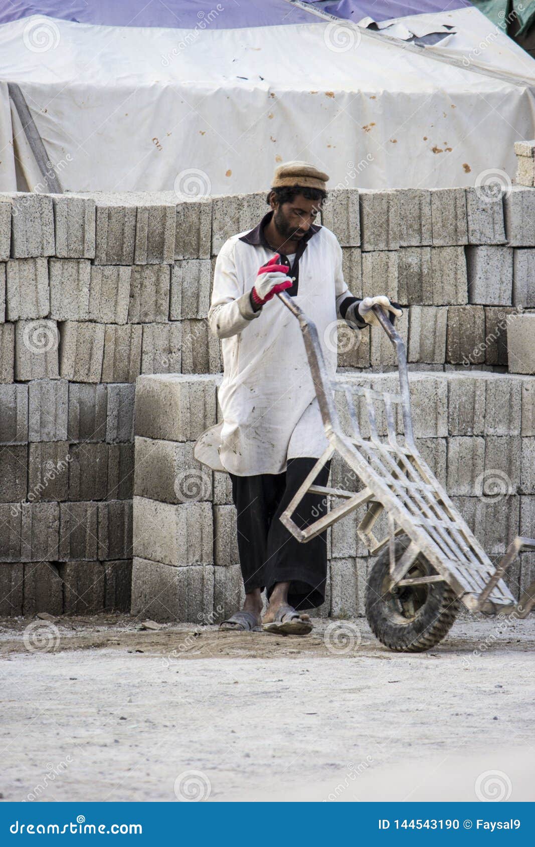 A Construction Worker Carrying Blocks Editorial Image - Image of ...