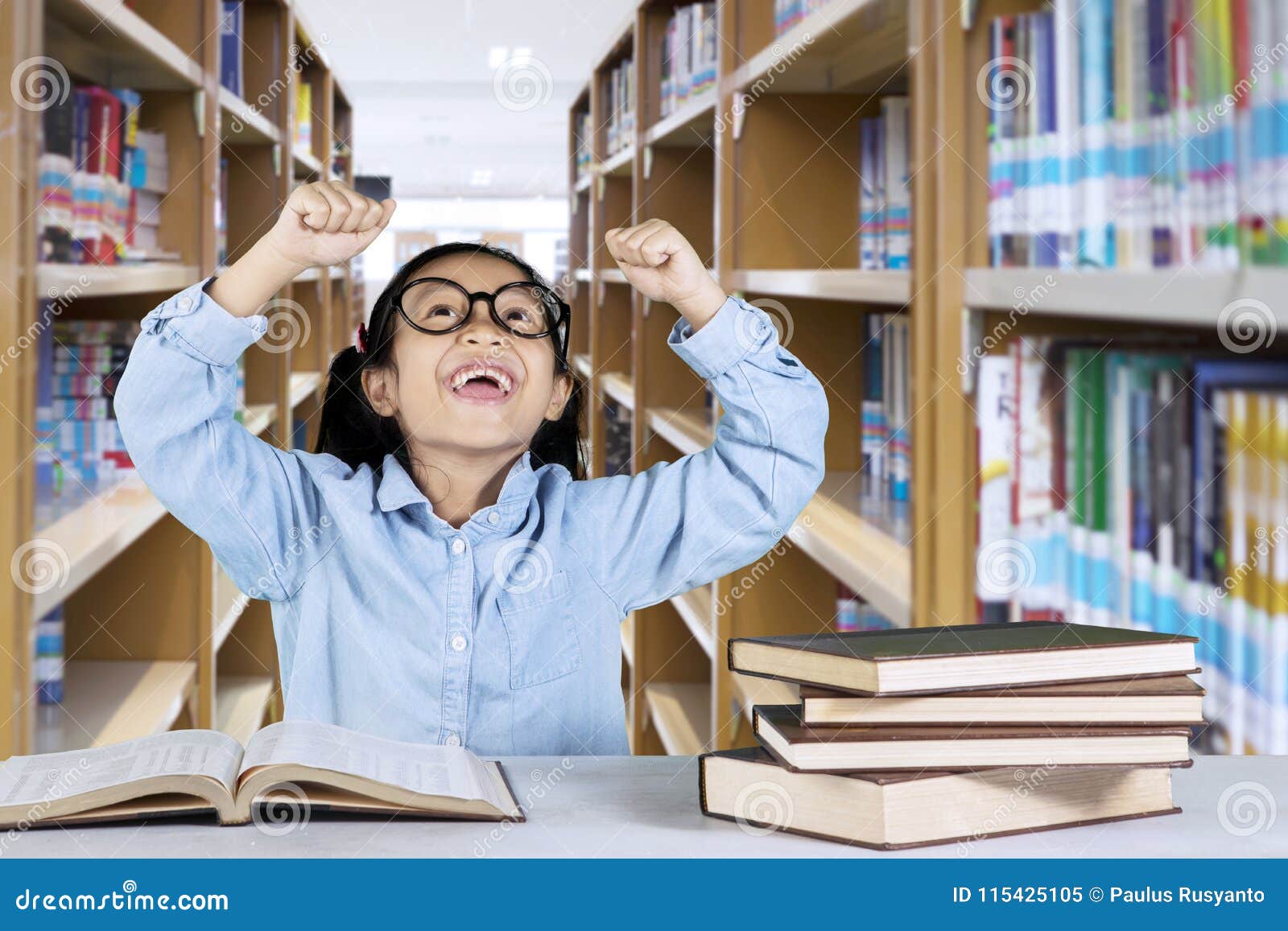 Elementary Student Celebrating Her Success in the Library Stock Image ...