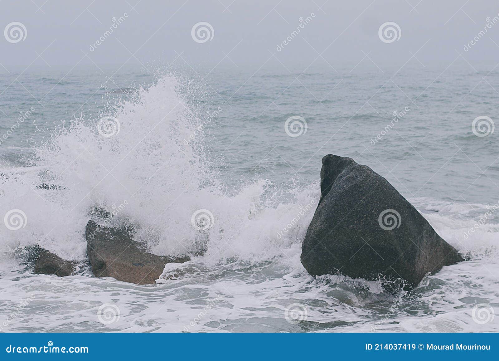 A Picture of the Force of Wave Collision with Beach Rocks. Stock Image ...