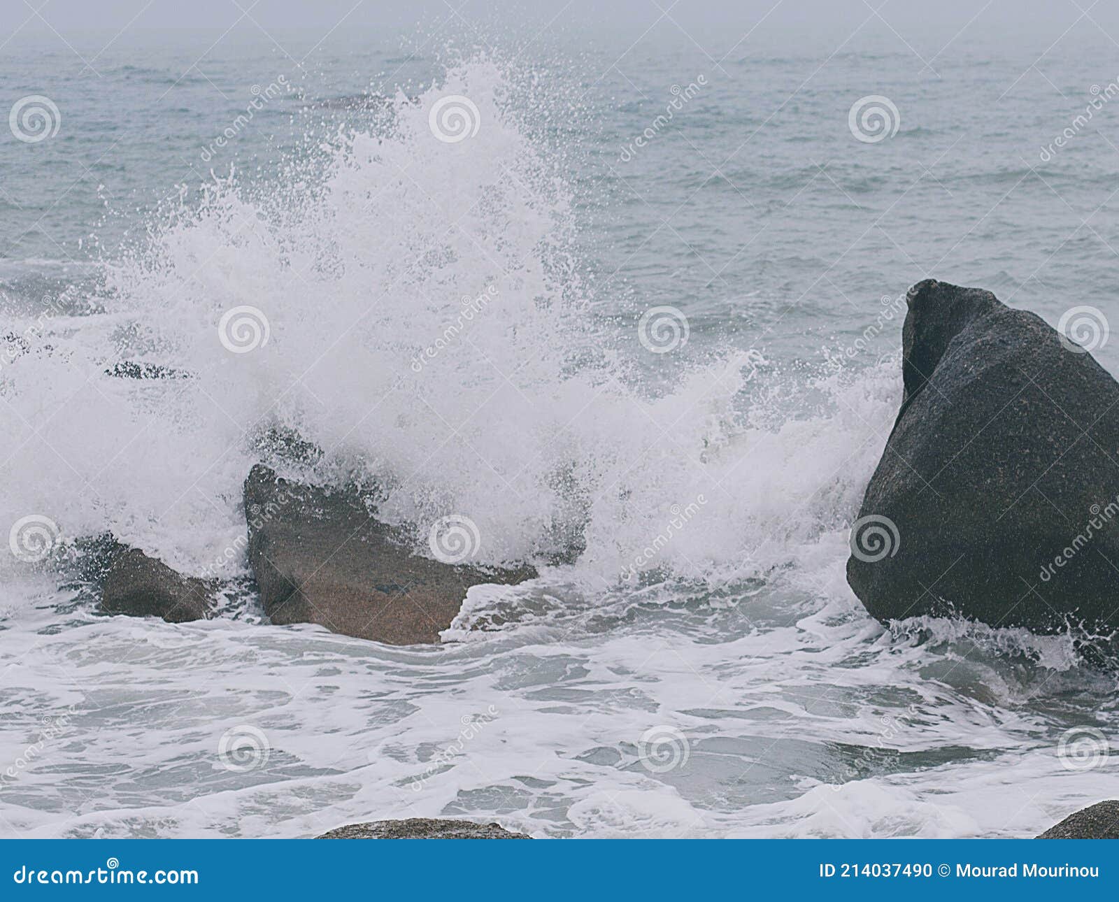 A Picture of the Force of Wave Collision with Beach Rocks. Stock Photo ...