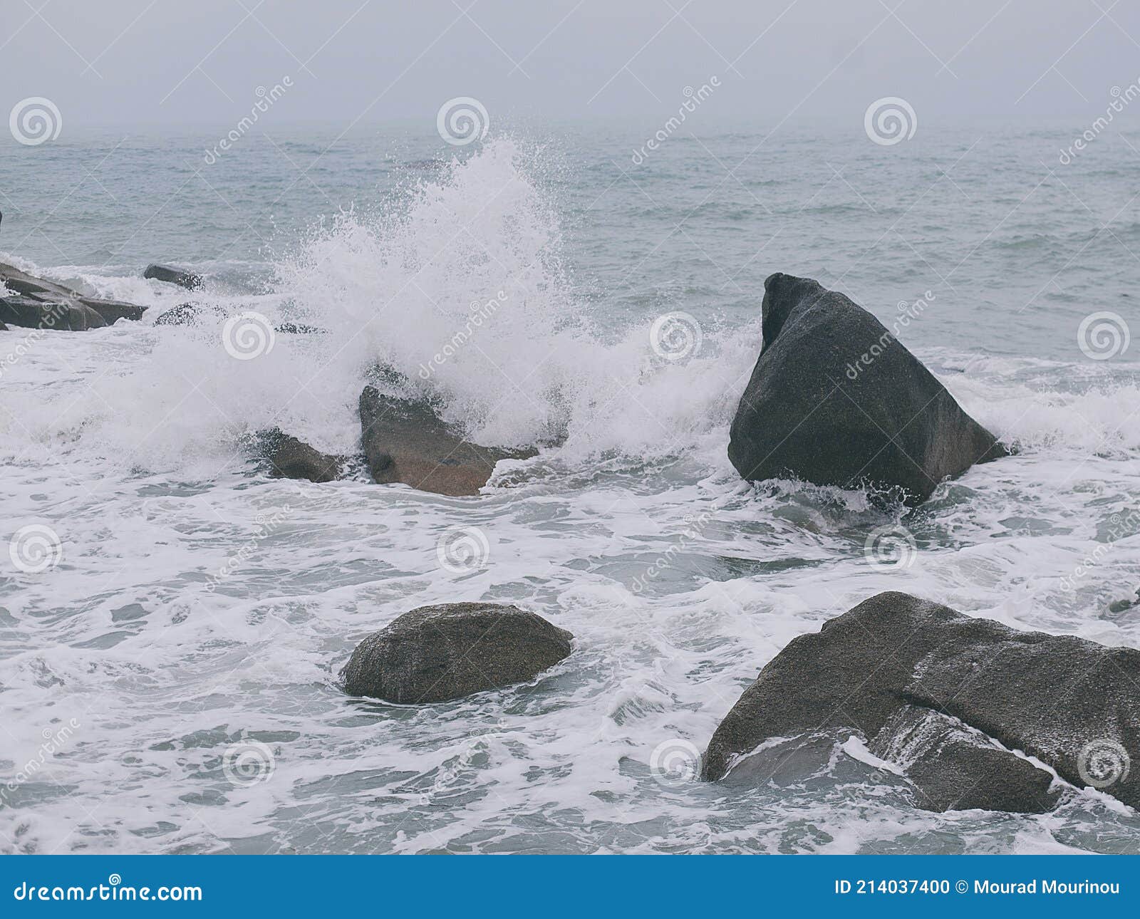 A Picture of the Force of Wave Collision with Beach Rocks. Stock Photo ...