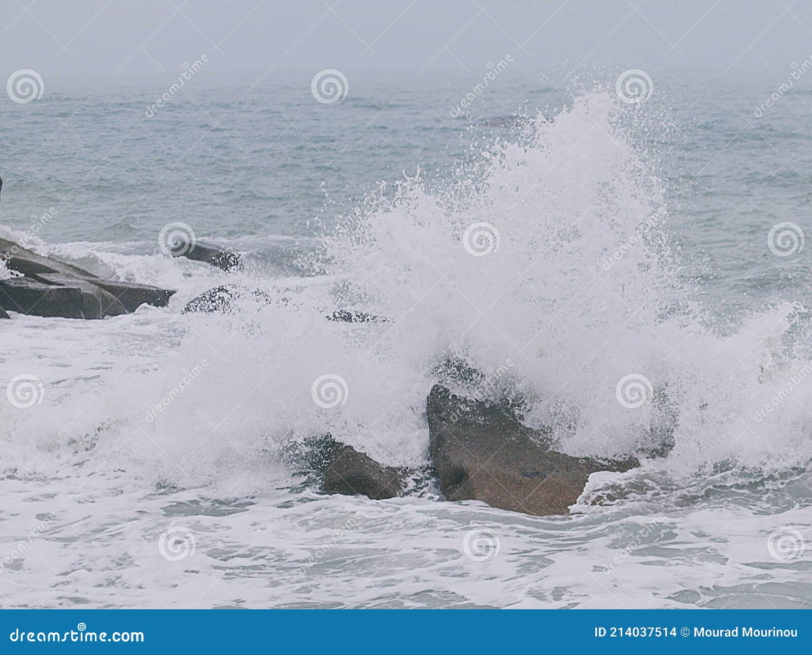 A Picture of the Force of Wave Collision with Beach Rocks. Stock Photo ...