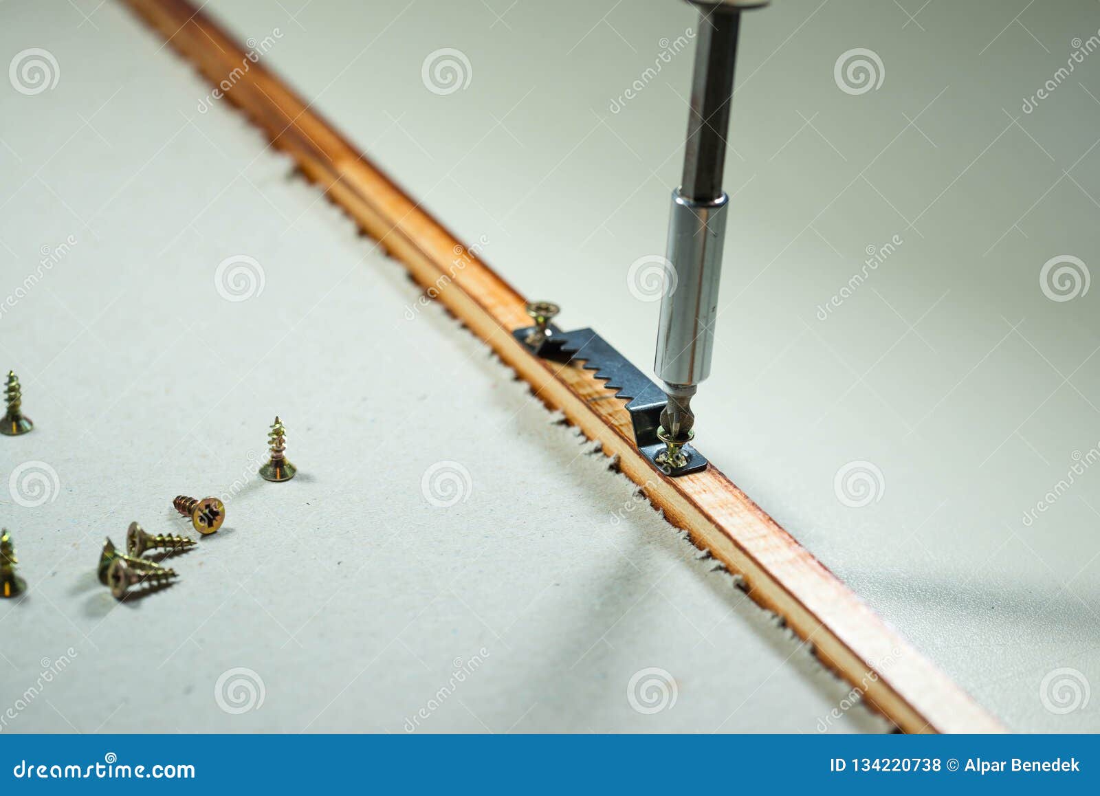 Picture Framer Fixing the Hangers with the Screwdriver Stock Photo ...