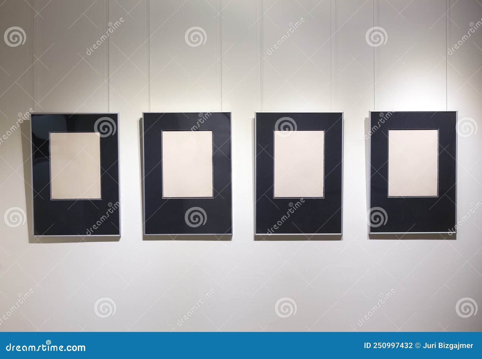 Picture Frames in a Row on a White Wall Stock Photo - Image of indoors ...