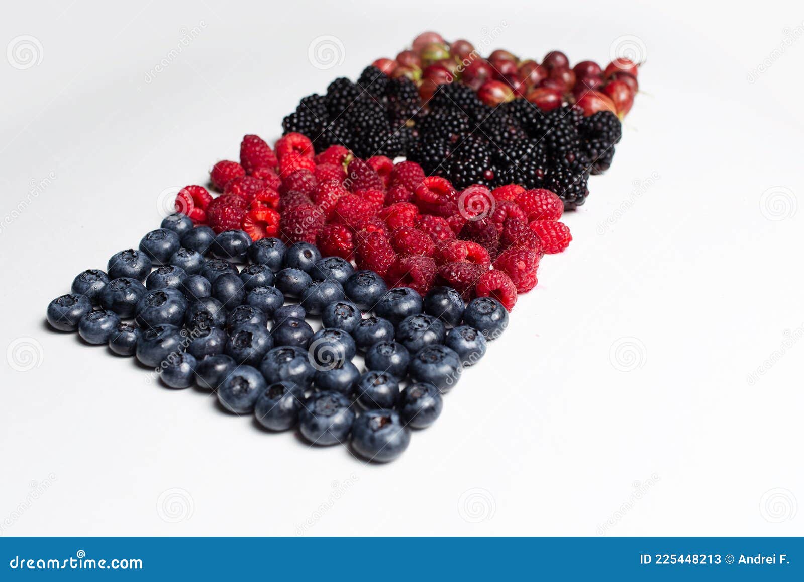 Picture of Fresh Wild Berries Situated in Line, on the White Table ...