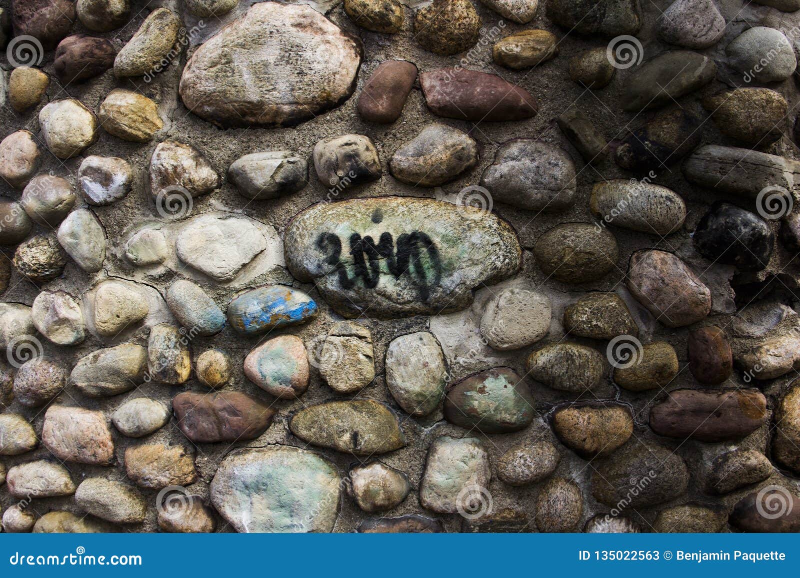 Graffiti on a stone wall stock image. Image of stone - 135022563