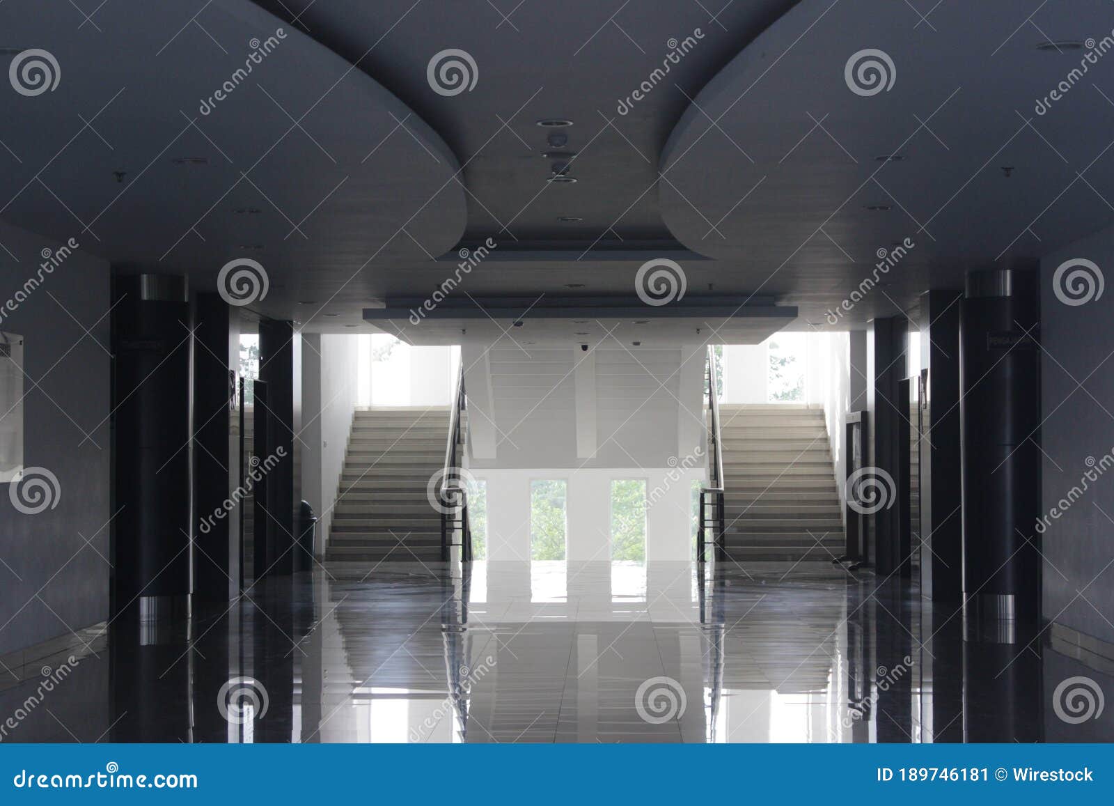 Picture of a Hall Sided by Elevators and Stairs in the Business ...