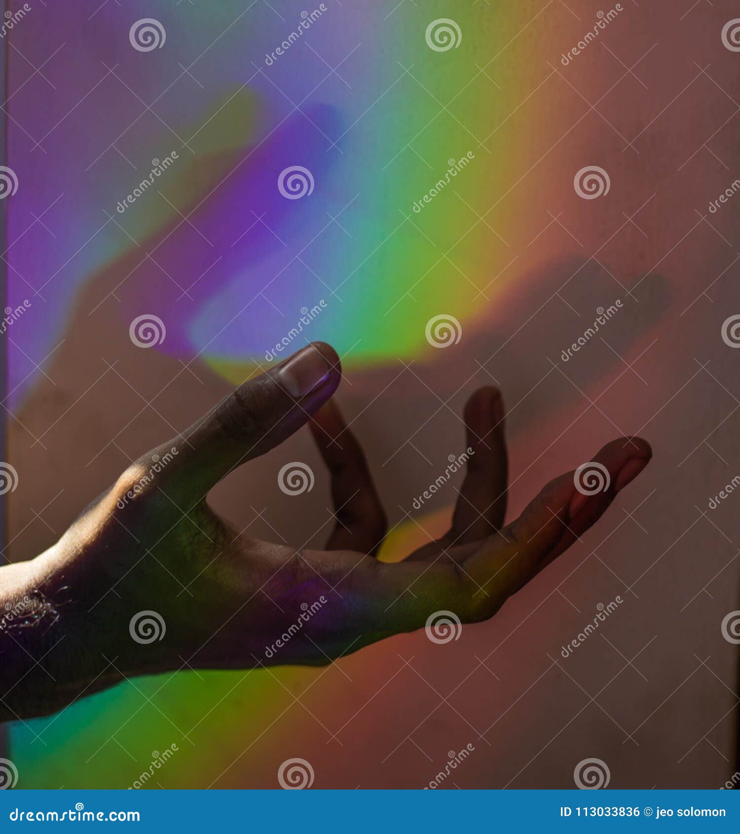 Hand in a rainbow stock photo. Image of colored, reflection - 113033836