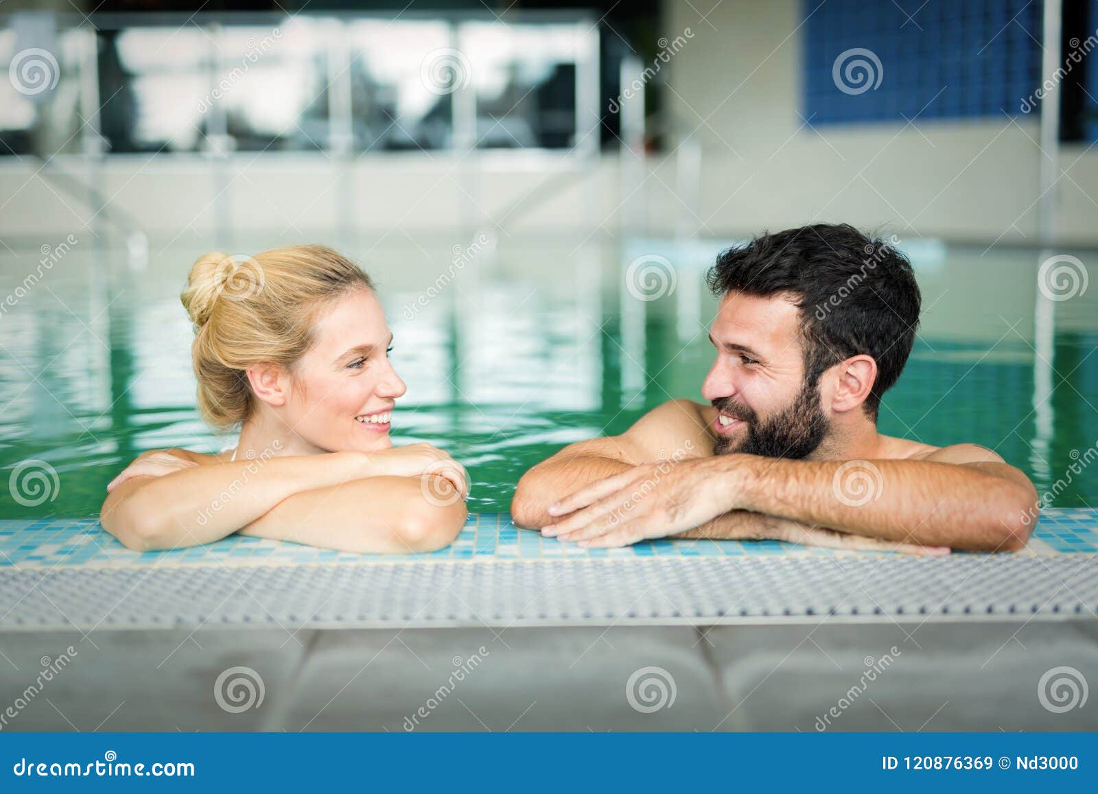 Picture of Happy Couple Relaxing in Pool Stock Image - Image of hotel ...