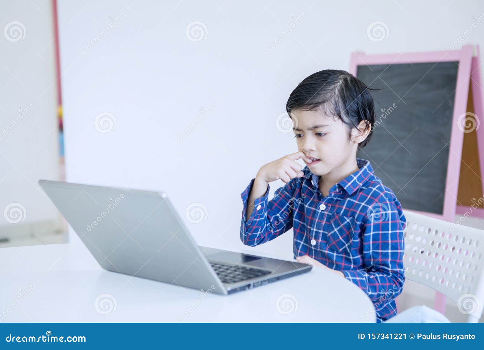 Little Boy Thinking Something during Using a Laptop Stock Image - Image ...