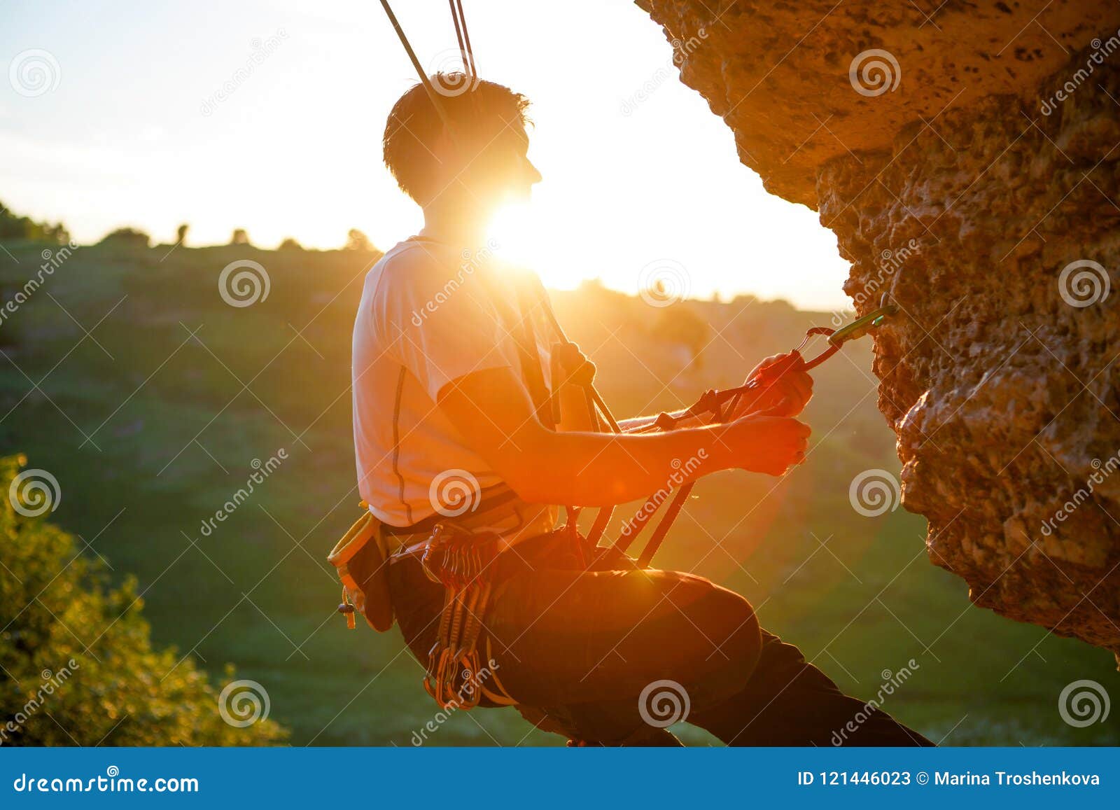 Picture of Man Clambering Over Rock. Stock Image - Image of lensflare ...