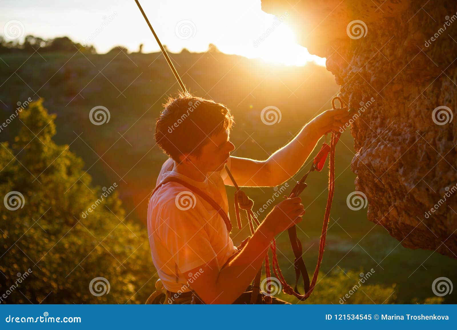 Picture of Man Clambering Over Rock. Stock Image - Image of plants ...