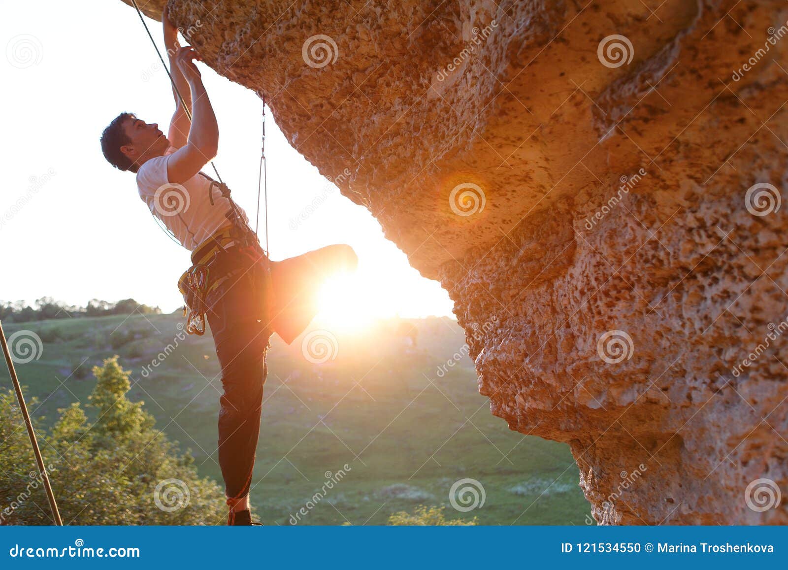 Picture of Man Clambering Over Rock. Stock Photo - Image of alpinists ...