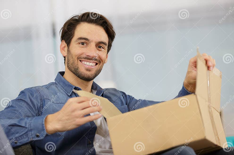 Picture man opening box stock image. Image of customer - 313277223
