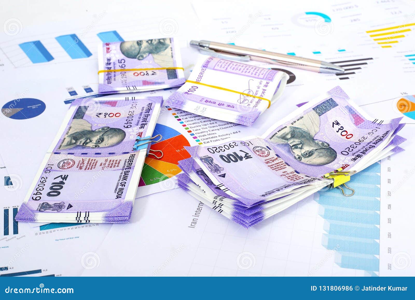 Multiple New Pack Of Indian 10 Rupee Notes And Pen On The Chart Paper ...