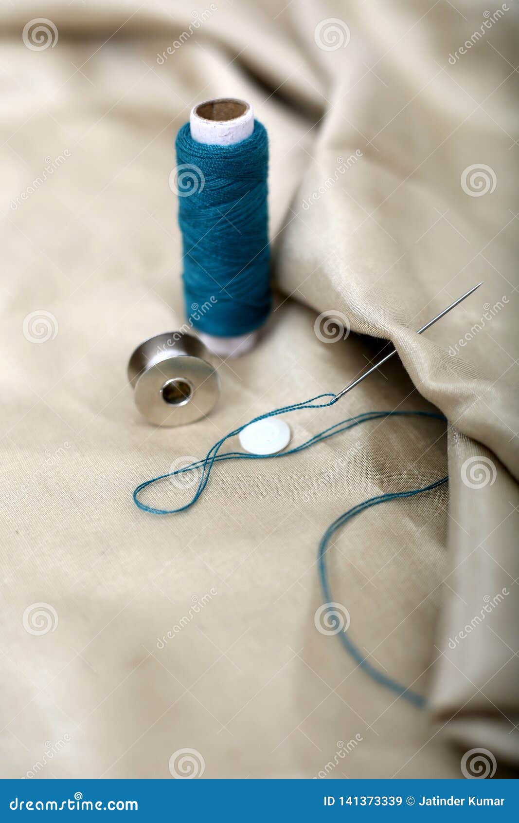 Picture of Needle Attached in Cloth with Sewing Thread and Bobbin Stock ...