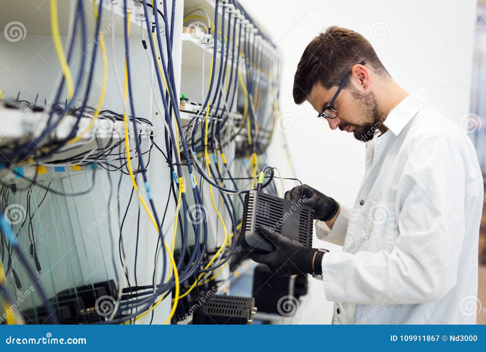 Picture of Network Technician Testing Modems in Factory Stock Image ...