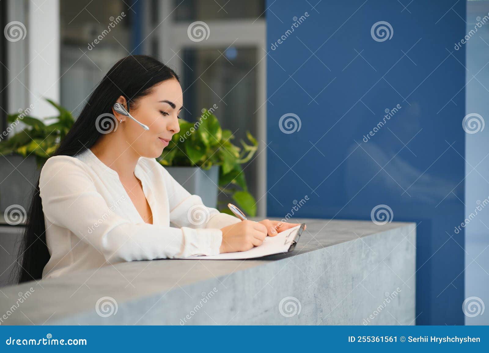 Picture of Pretty Receptionist at Work. Stock Image - Image of employee ...