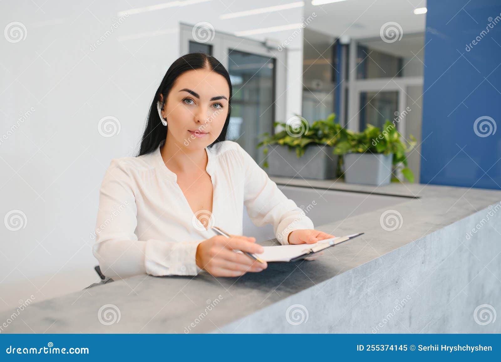 Picture of Pretty Receptionist at Work. Stock Image - Image of ...
