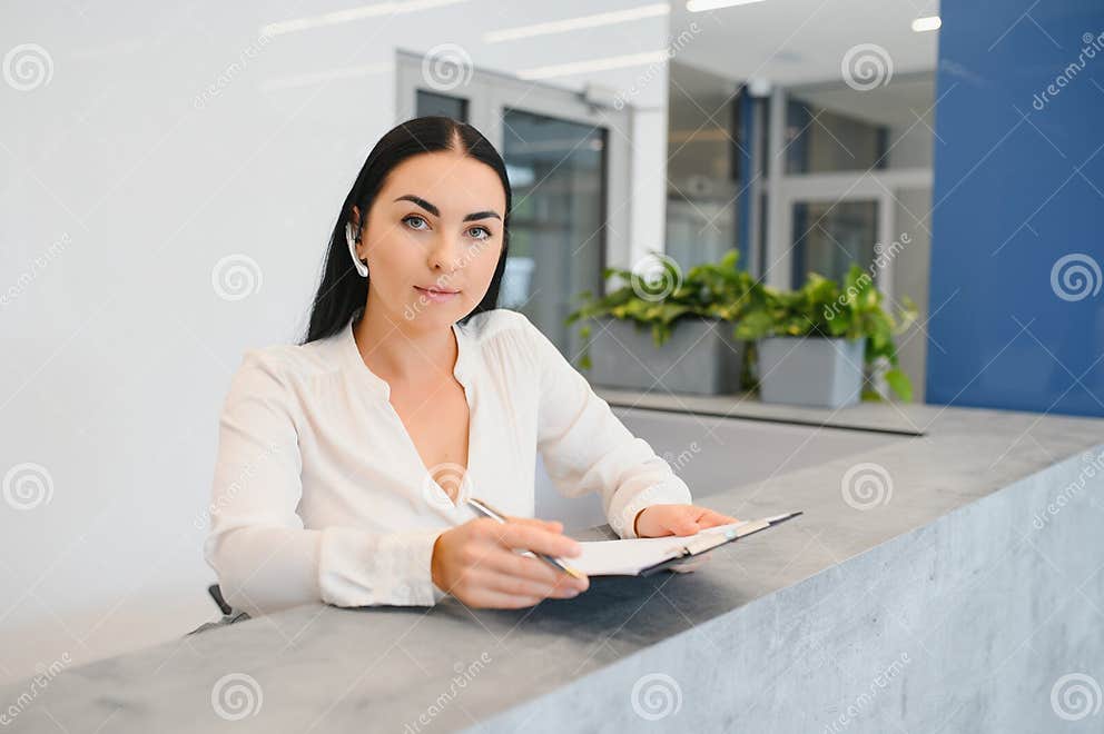 Picture of Pretty Receptionist at Work. Stock Image - Image of ...