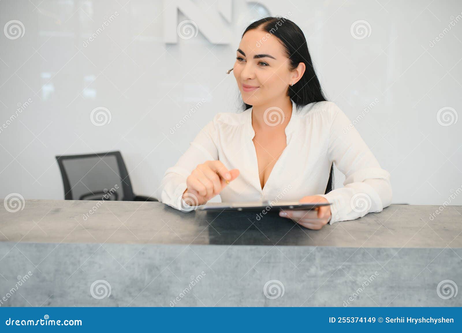 Picture of Pretty Receptionist at Work. Stock Image - Image of people ...