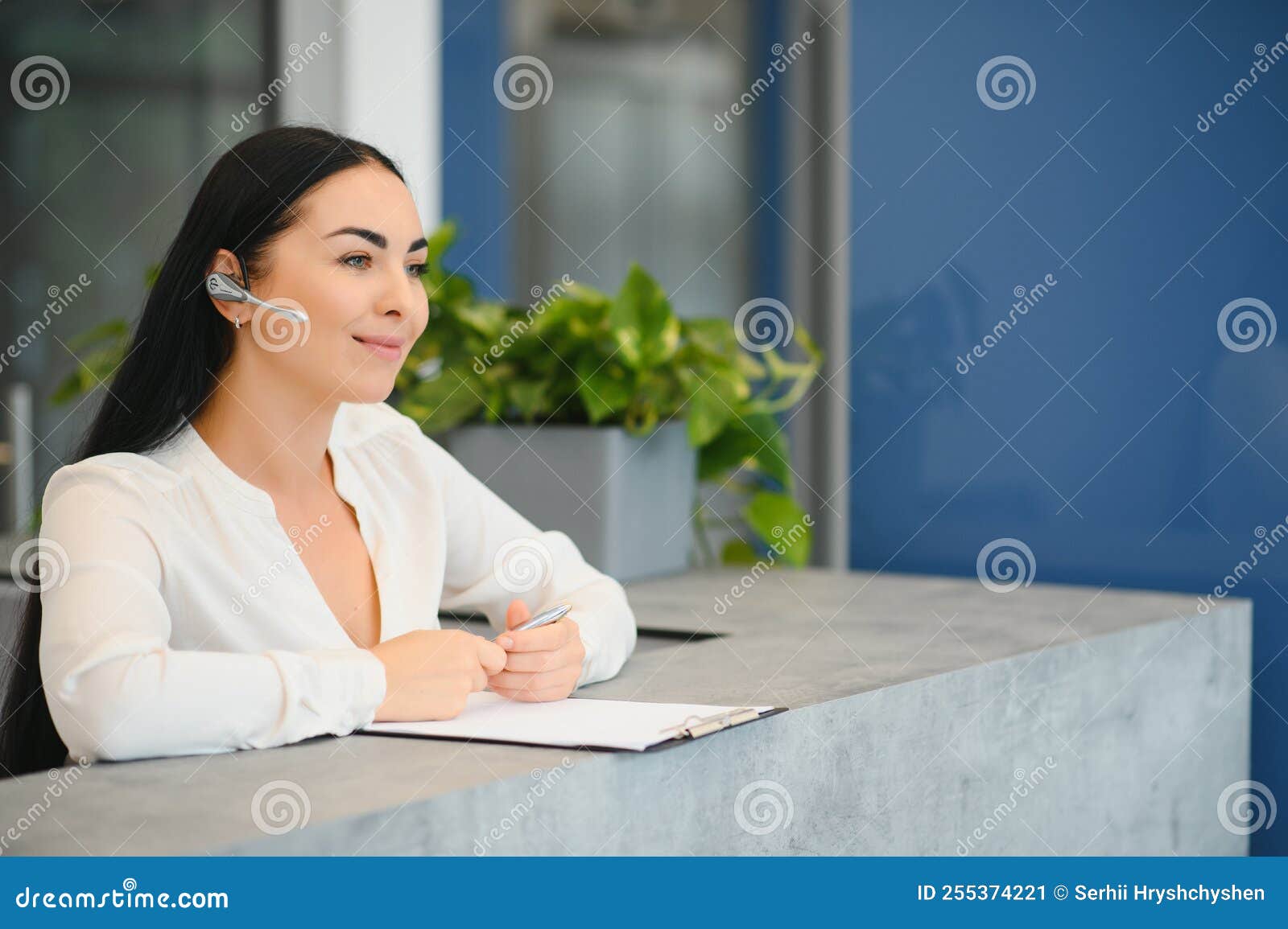 Picture of Pretty Receptionist at Work. Stock Image - Image of business ...