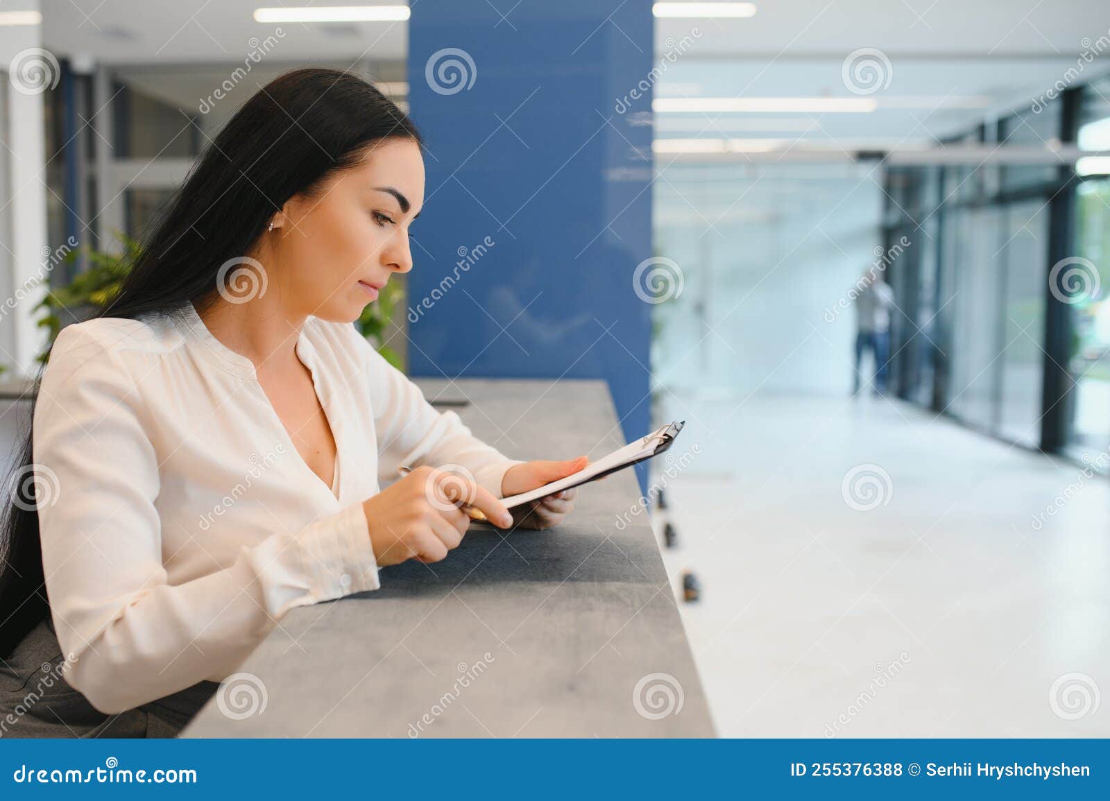 Picture of Pretty Receptionist at Work. Stock Photo - Image of ...