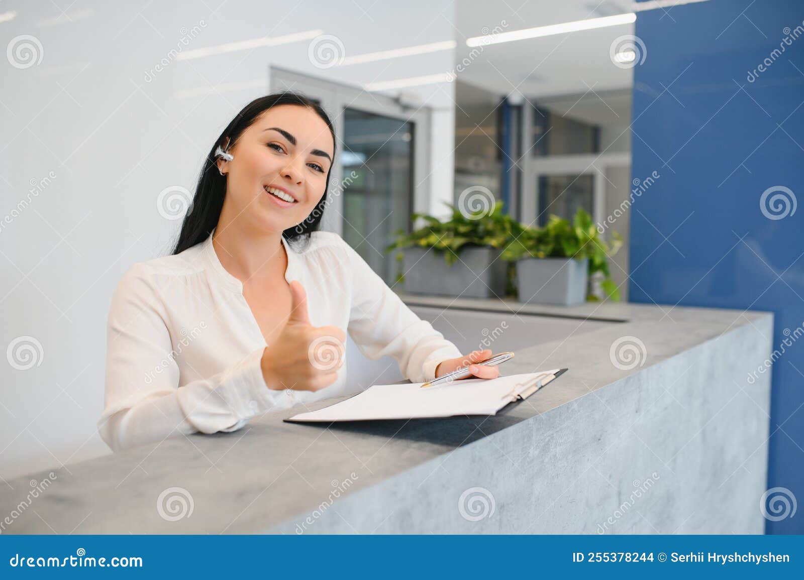 Picture of Pretty Receptionist at Work. Stock Photo - Image of girl ...