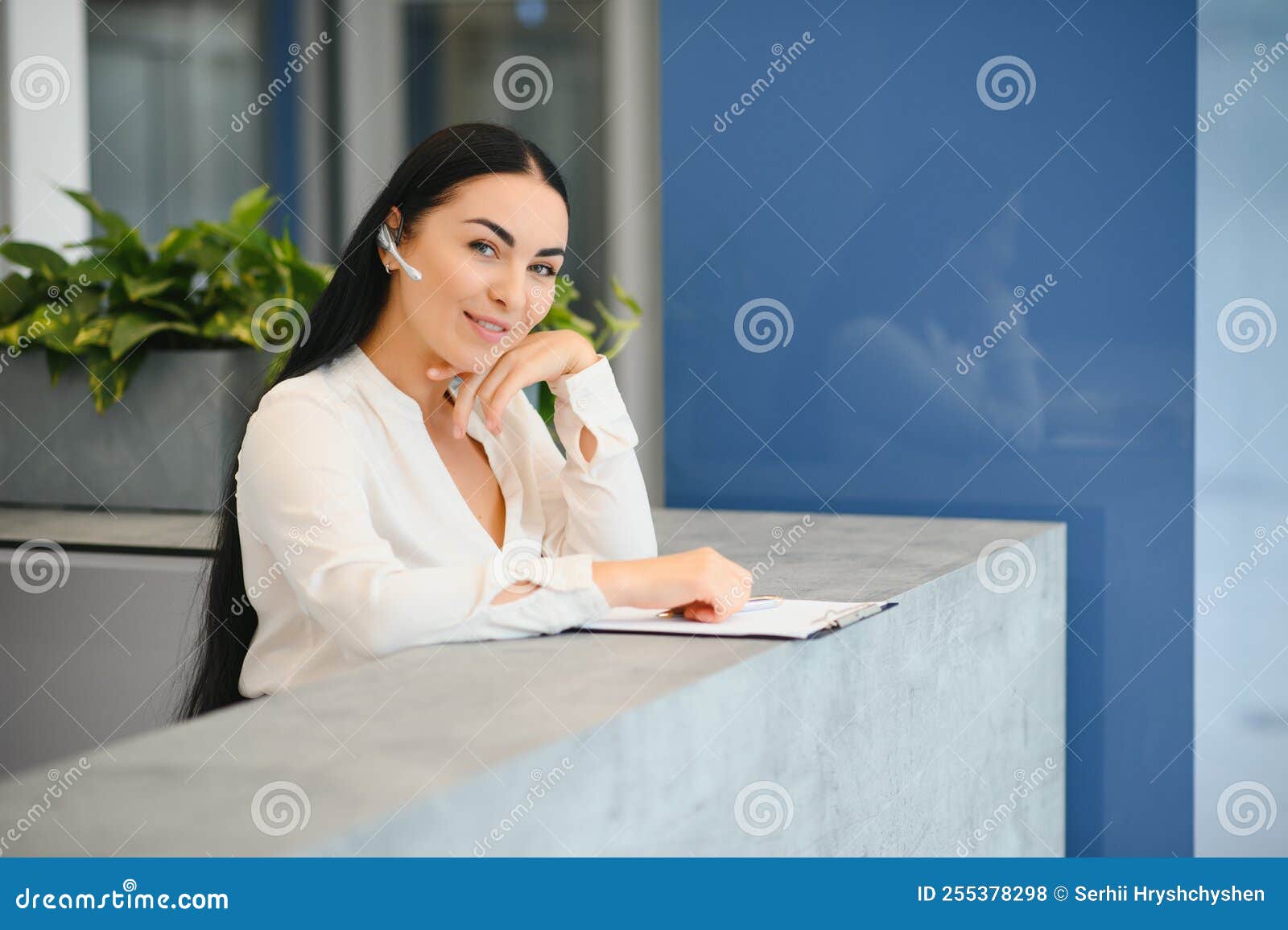 Picture of Pretty Receptionist at Work. Stock Photo - Image of employee ...