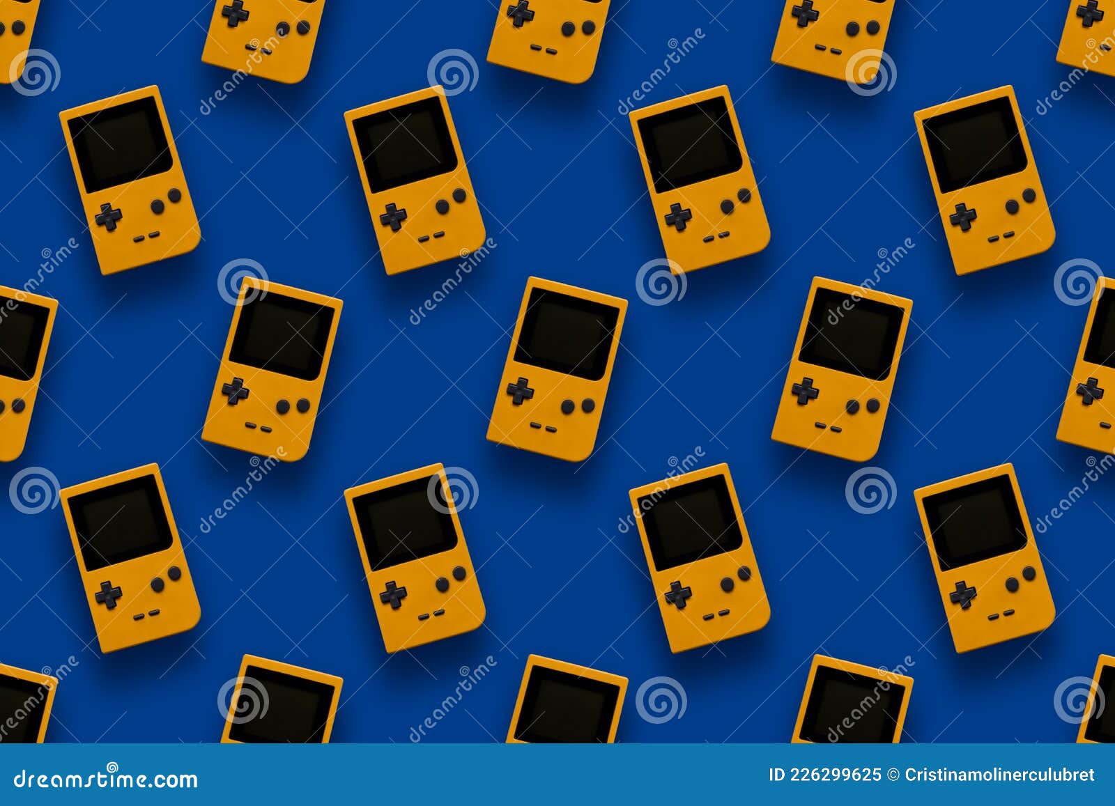 Picture of Retro Yellow Game Console Pattern on Blue Background Stock ...