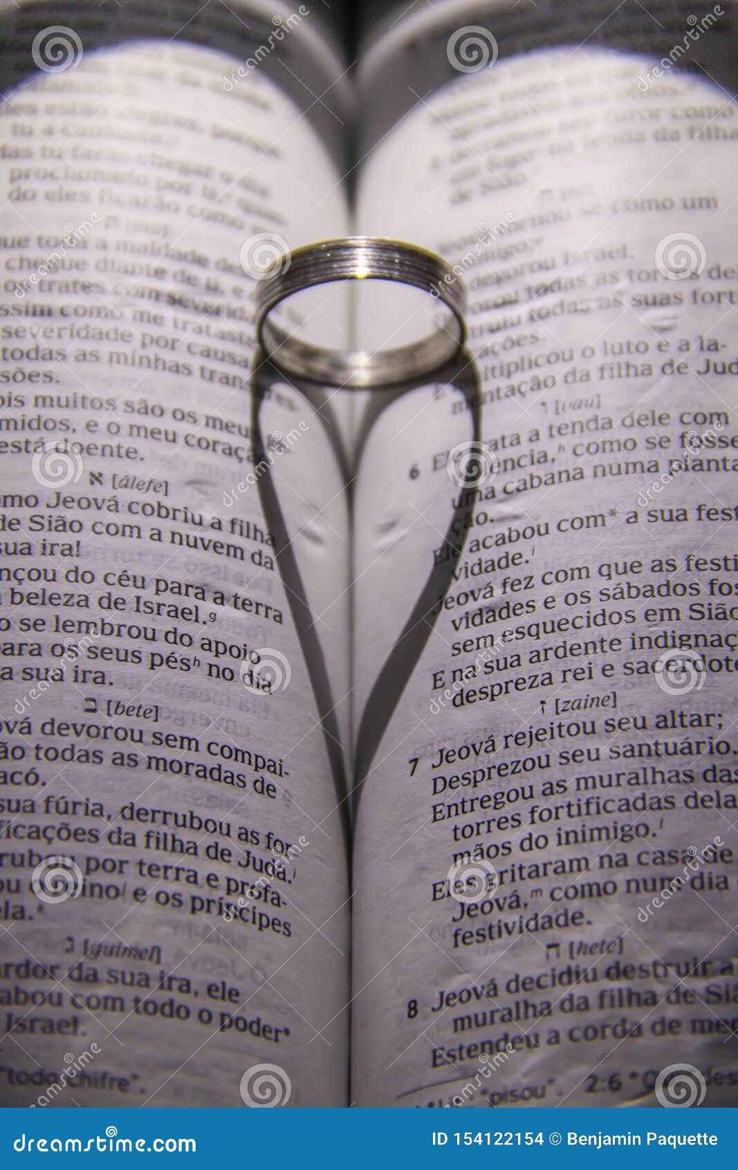 Ring Making a Heart Shape on the Bible Stock Photo - Image of study ...
