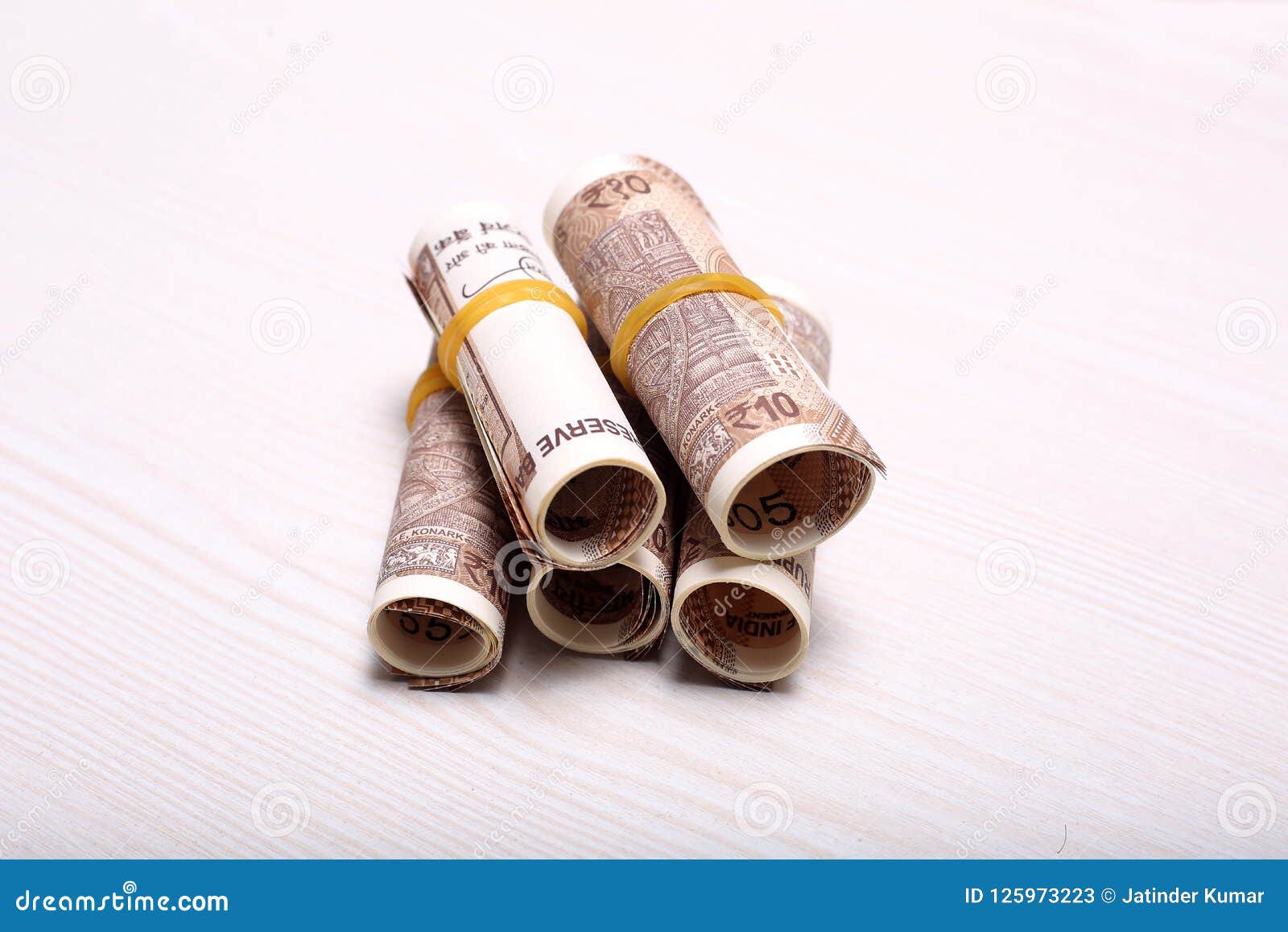 Rolls Of Indian Currency Rupee Notes With Magnifying Glass Royalty-Free ...