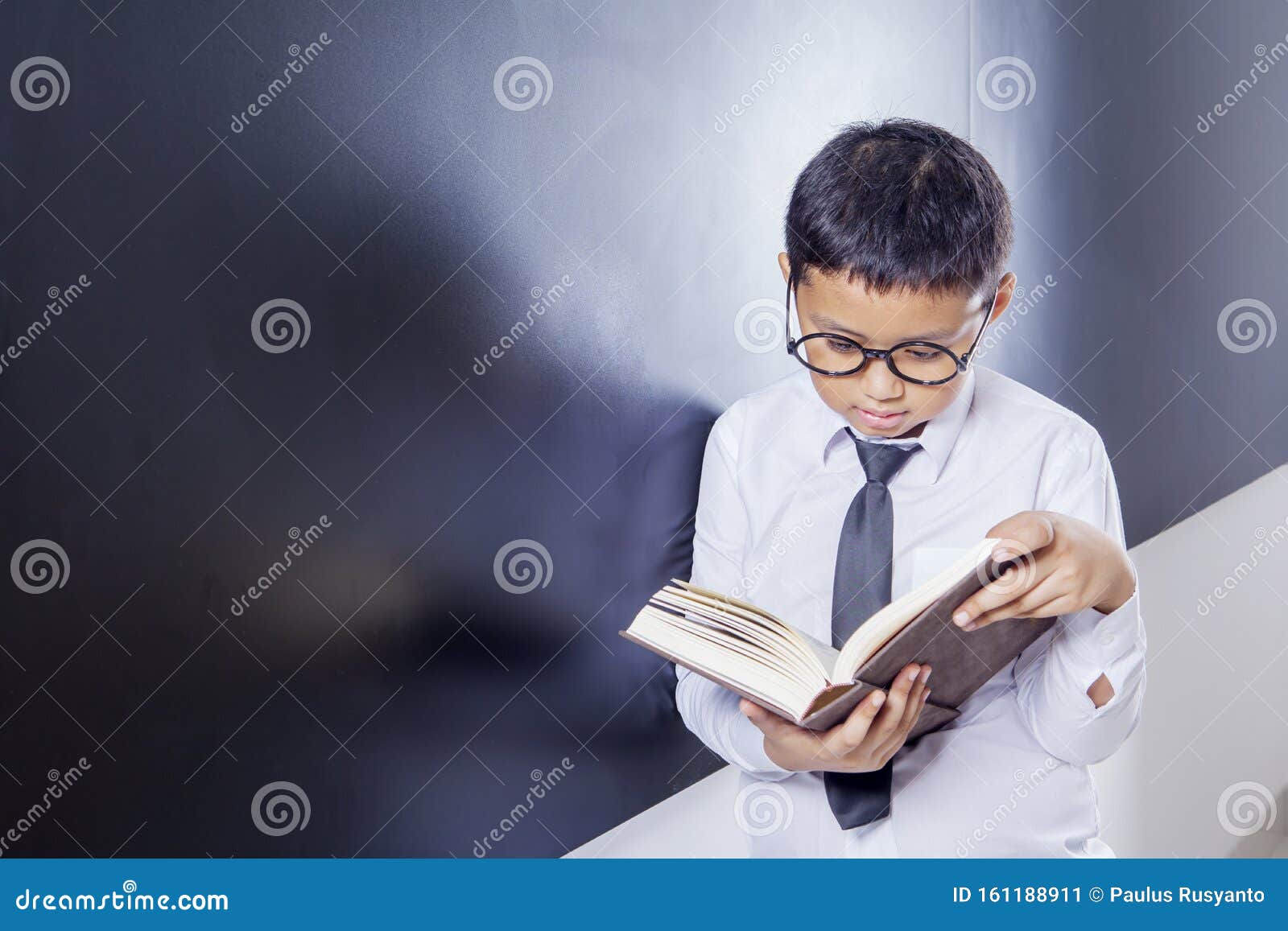 Schoolboy Reading a Book in the Classroom Stock Image - Image of ... Schoolboy Reading a Book in the Classroom Stock Image - Image of ...