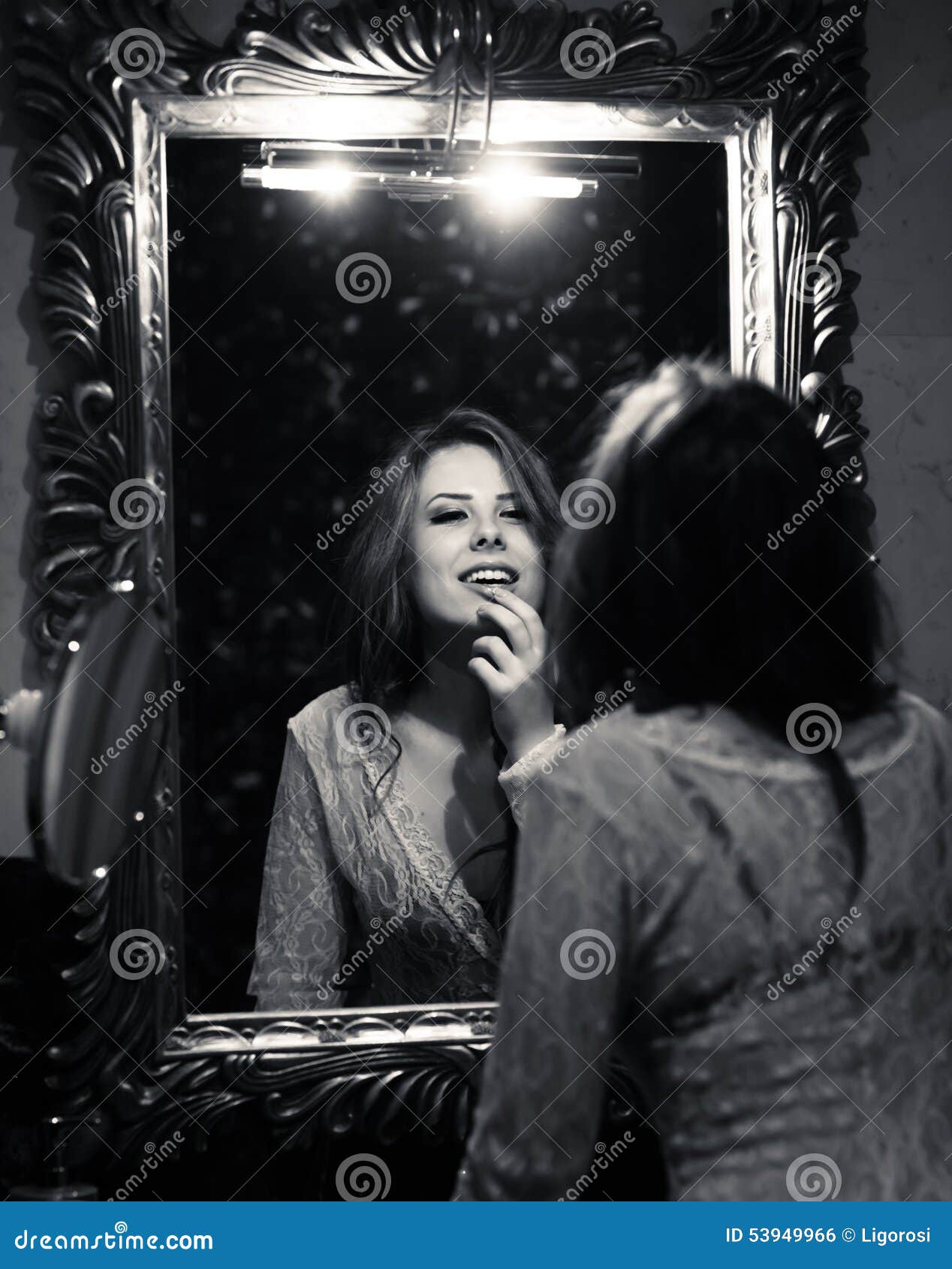 Picture of Sensual Beautiful Young Lady Looking in Mirror Stock Photo ...