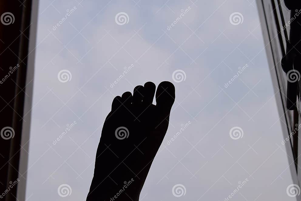 Shadow of a bare foot stock image. Image of seashore - 134406533