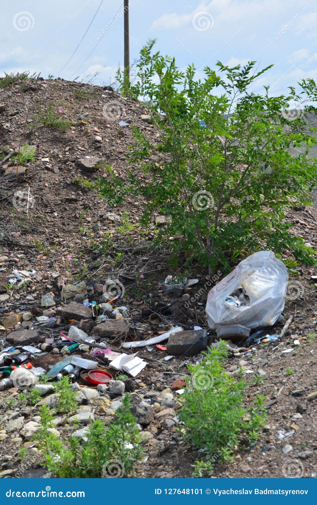 Some trash on a hill stock image. Image of column, bush - 127648101