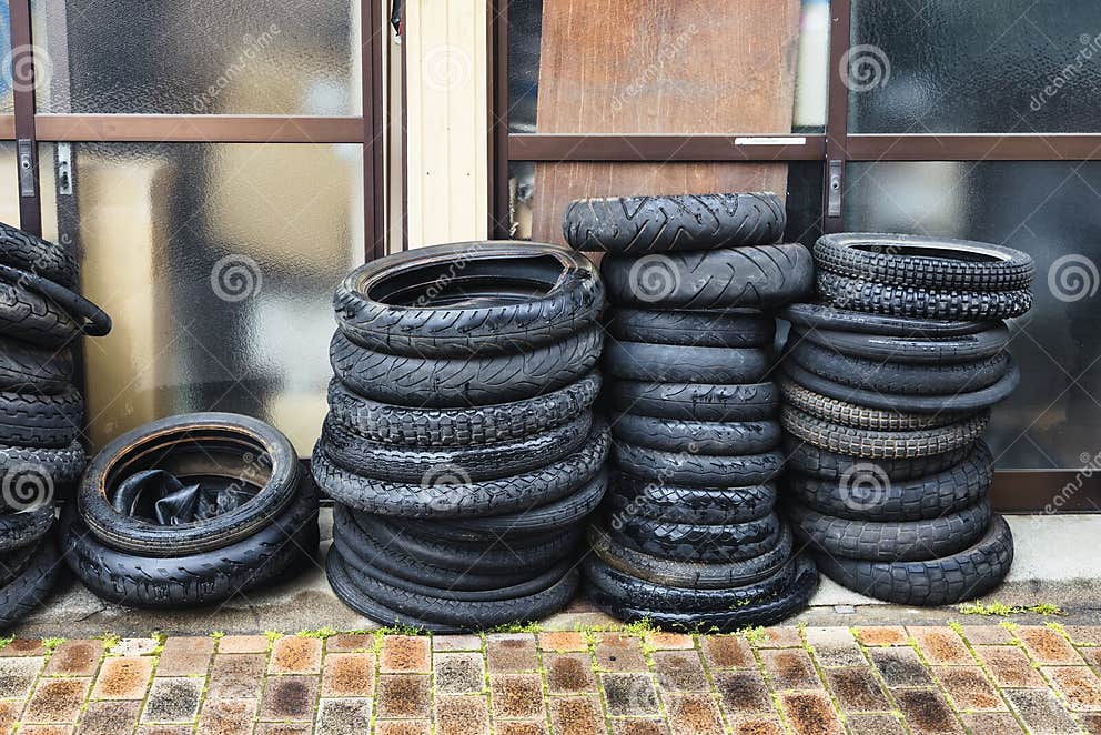 Stack of Worn Vehicle Tires at a Workshop Stock Image - Image of ...